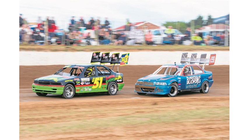 High-speed action at national oval racing spectacle | George Herald