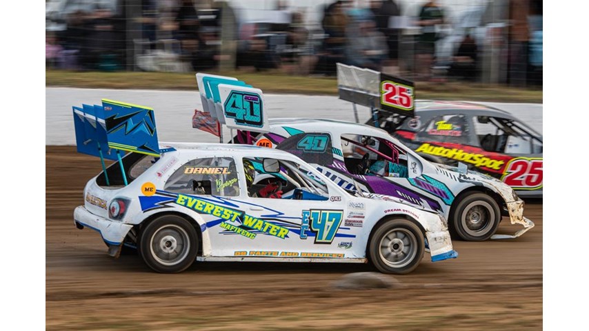 High-speed action at national oval racing spectacle | George Herald