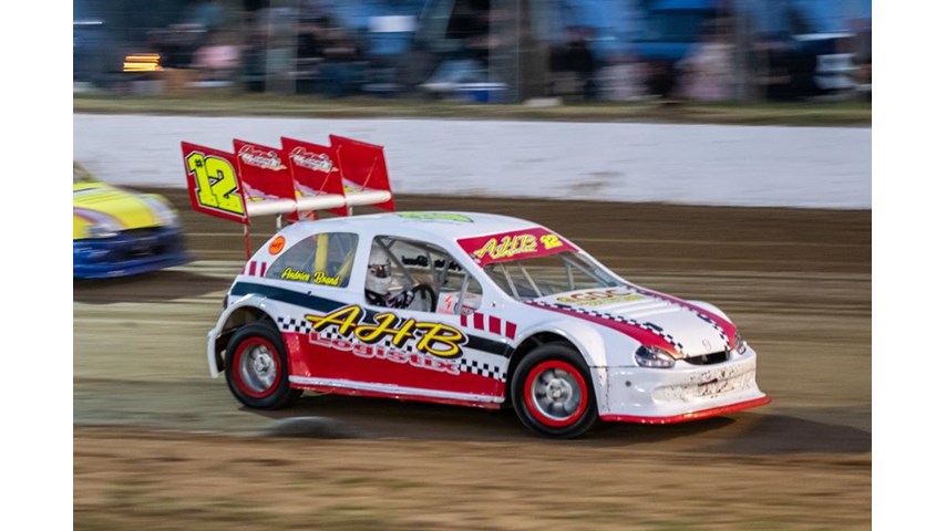 High-speed action at national oval racing spectacle | George Herald